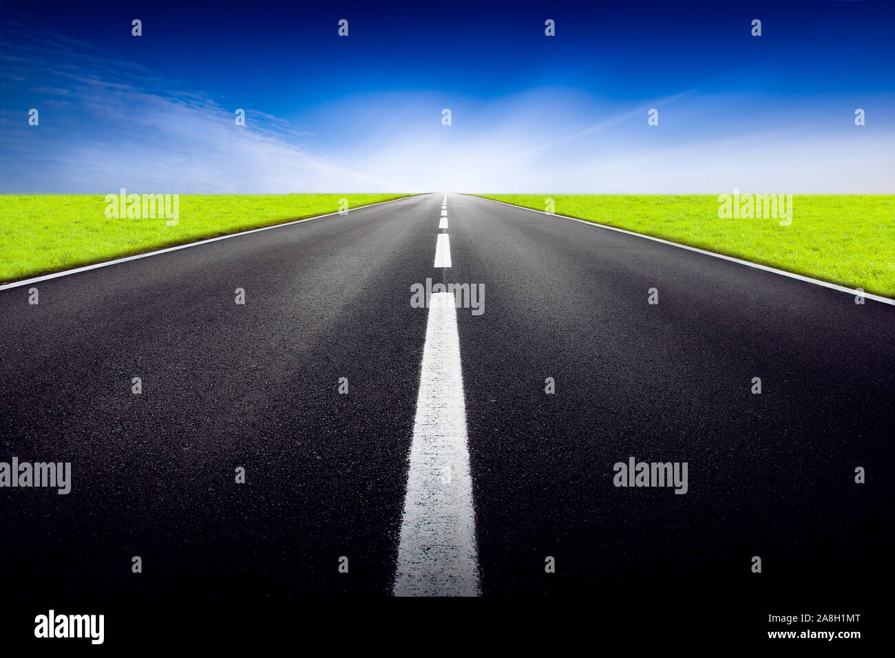 a fantastic desert road with blue sky Stock Photo - Alamy