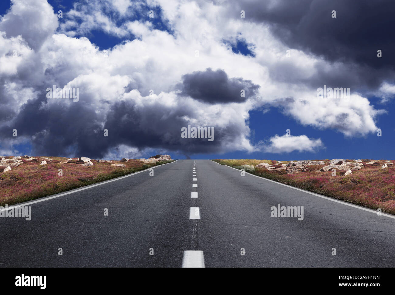 a fantastic desert road with clouds Stock Photo - Alamy