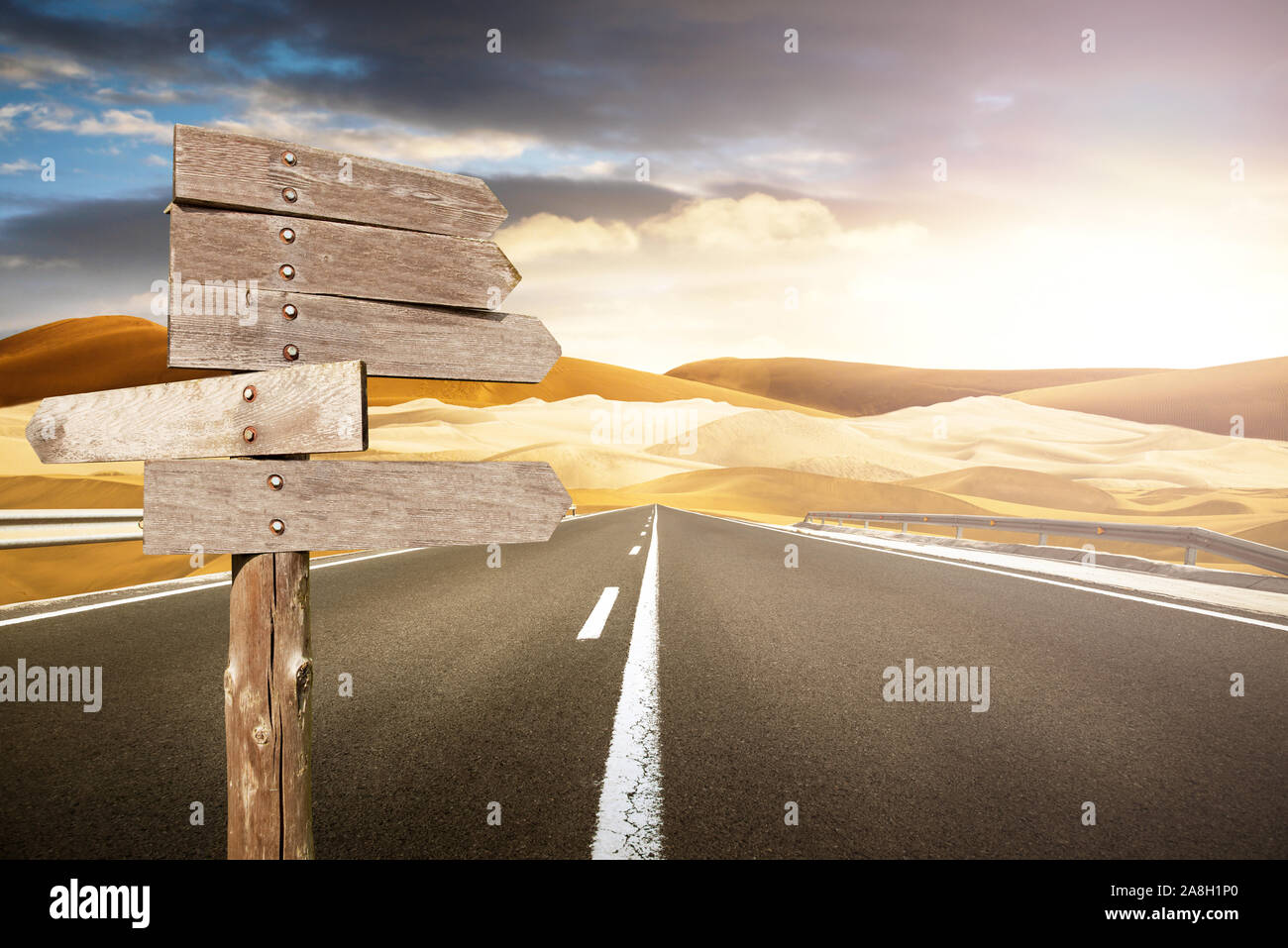 traffic signs in a desert road Stock Photo - Alamy