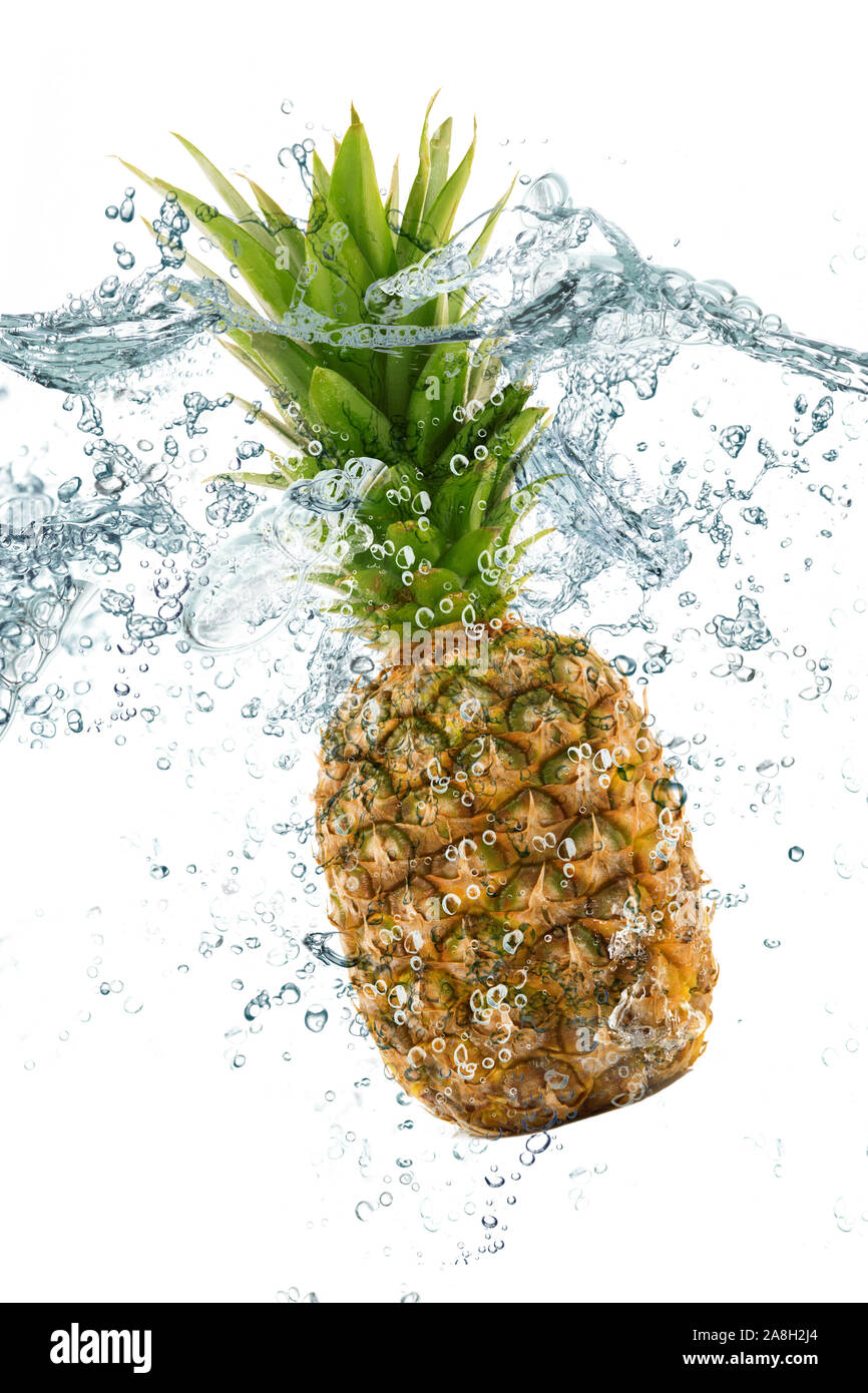 fresh pineapple falling in water Stock Photo - Alamy