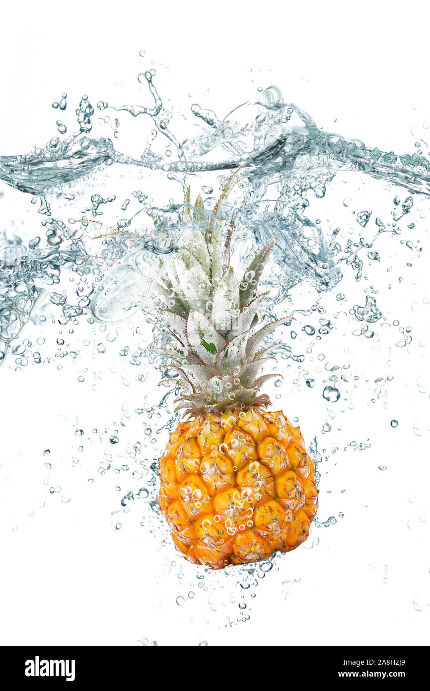fresh pineapple falling in water Stock Photo - Alamy