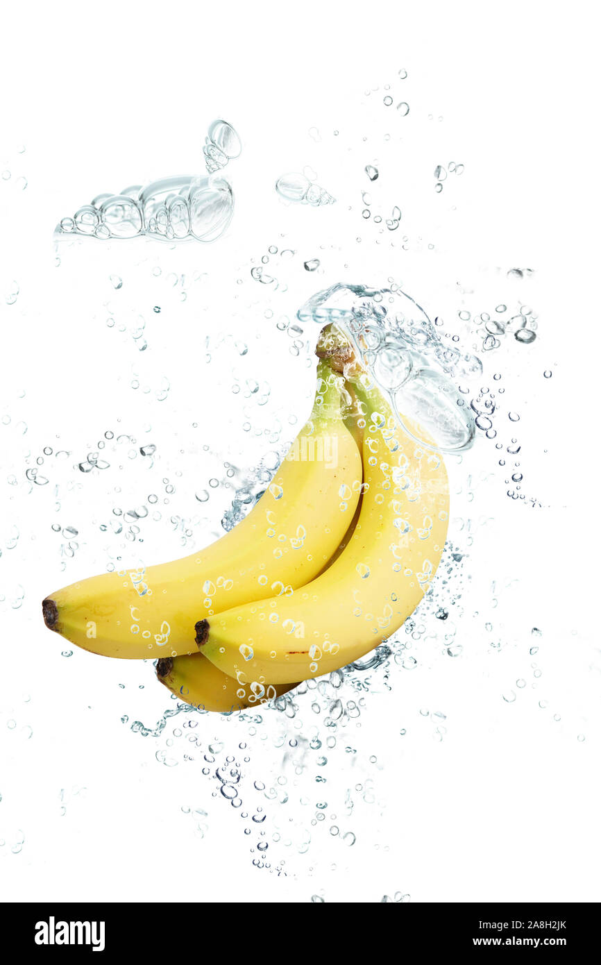 fresh bananas falling in water Stock Photo - Alamy