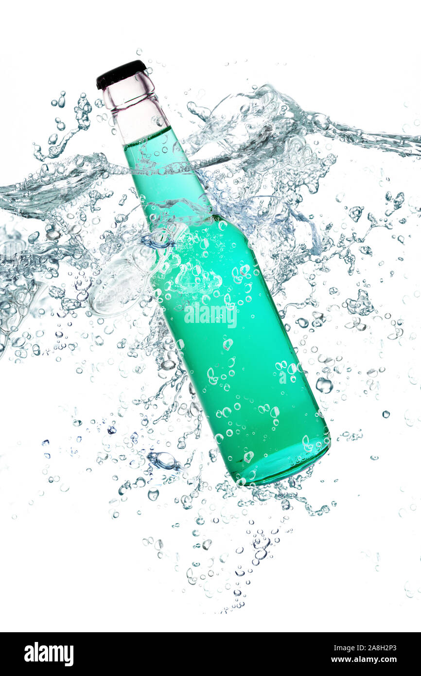 green glass bottle falling in water Stock Photo - Alamy