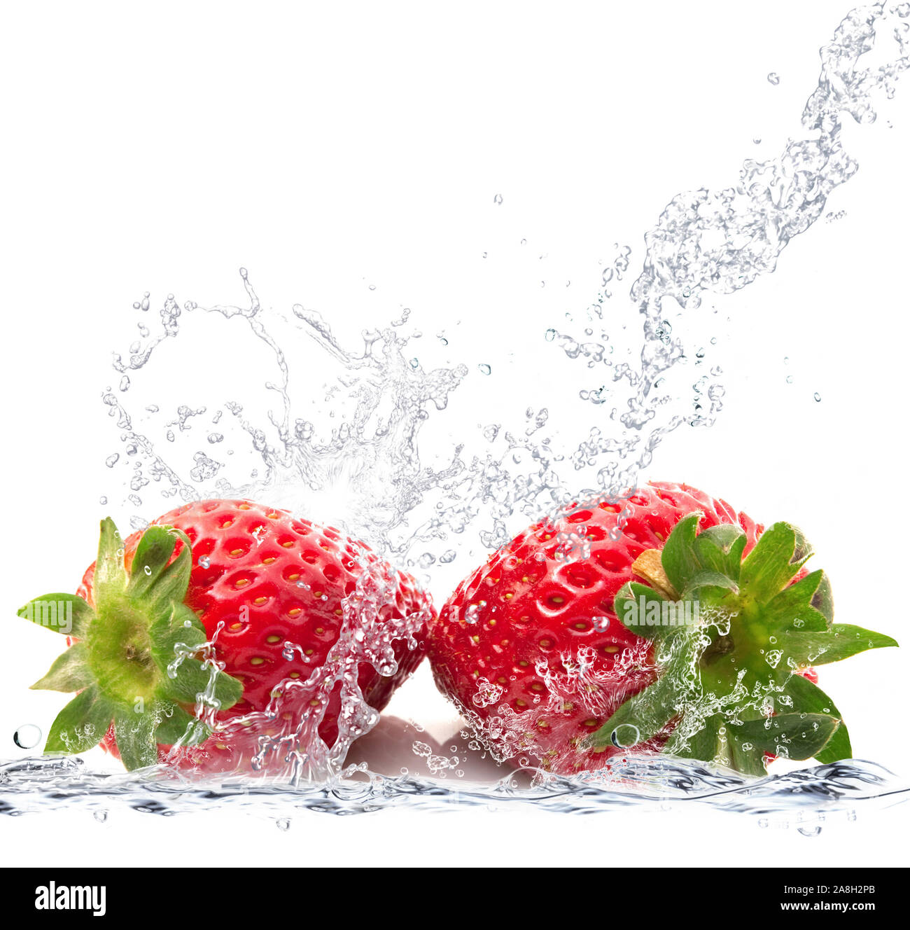 fresh strawberry falling in water Stock Photo - Alamy