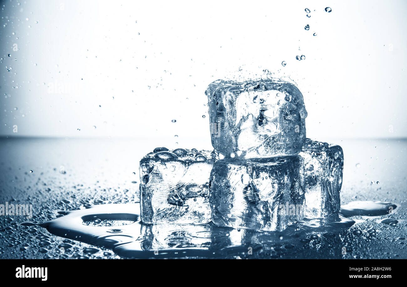 ice cube in water puddle Stock Photo - Alamy