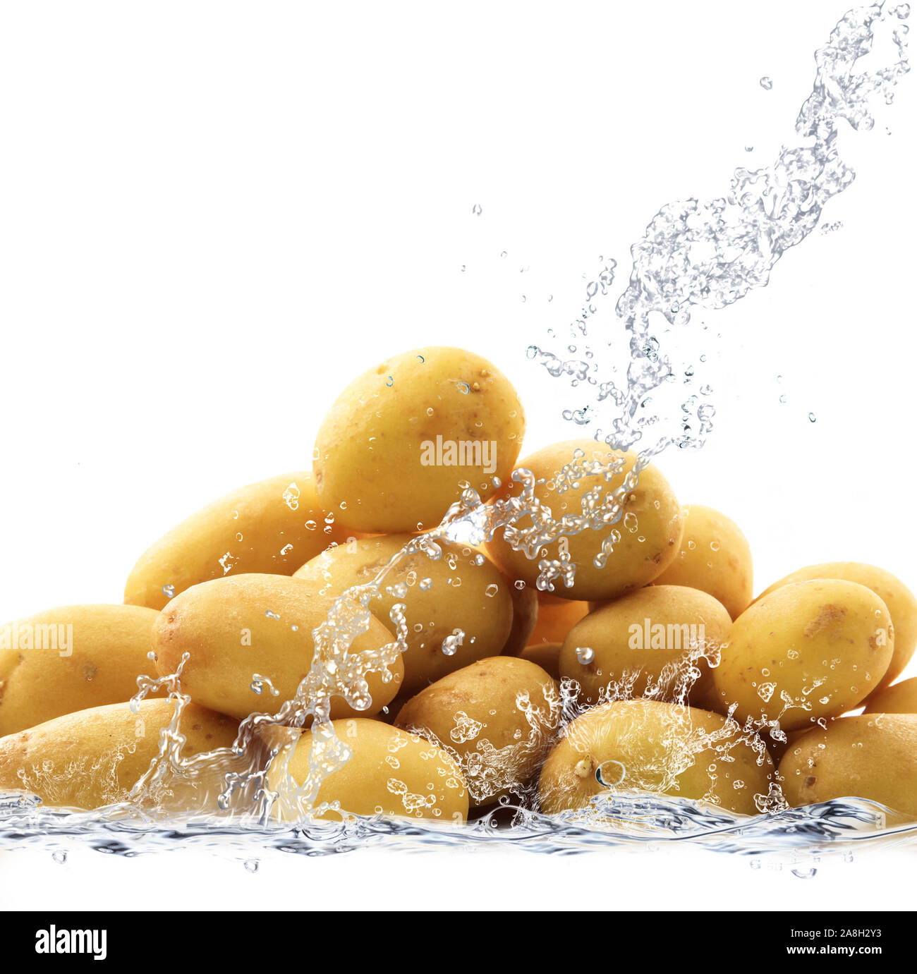 fresh potatoes falling in pure water Stock Photo - Alamy