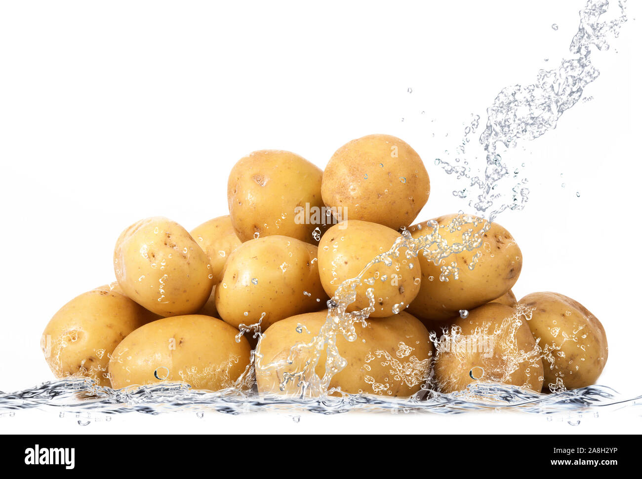 fresh potatoes falling in pure water Stock Photo - Alamy