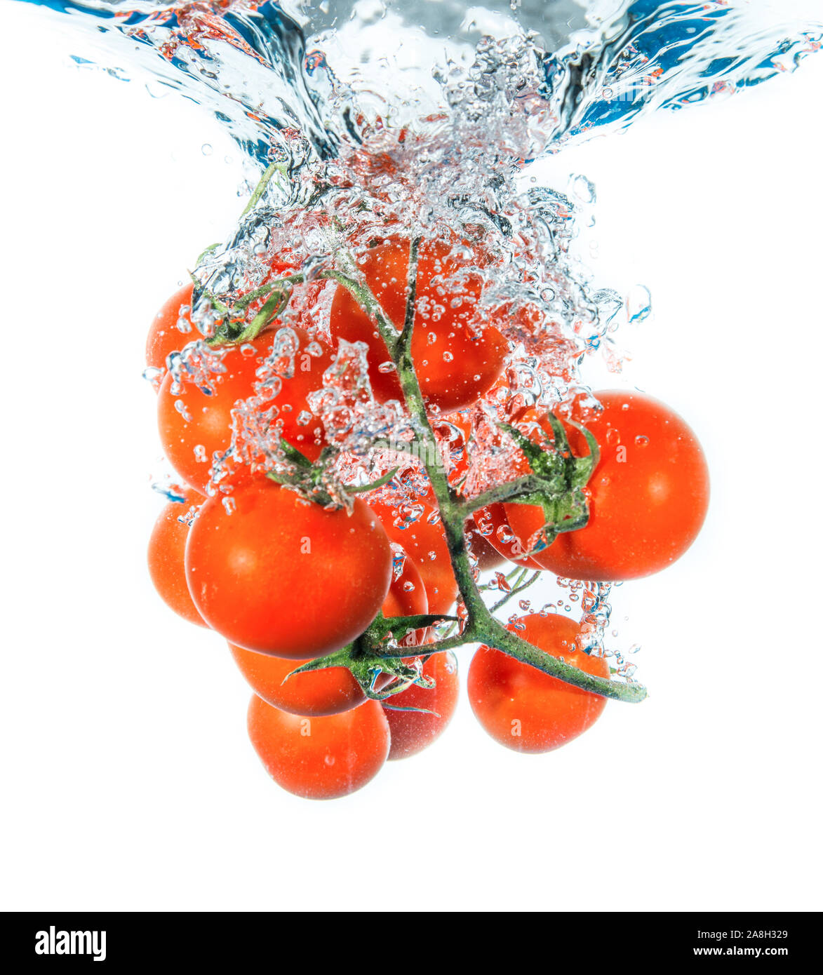 fresh tomatoes falling in pure water Stock Photo - Alamy