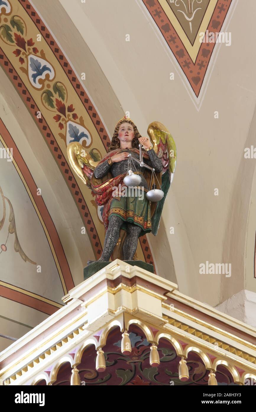 St. Michael the Archangel at the top of the pulpit in the church of ...