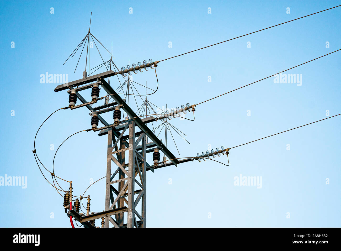 wiring and connection elements in an electricity turret on blue sky ...