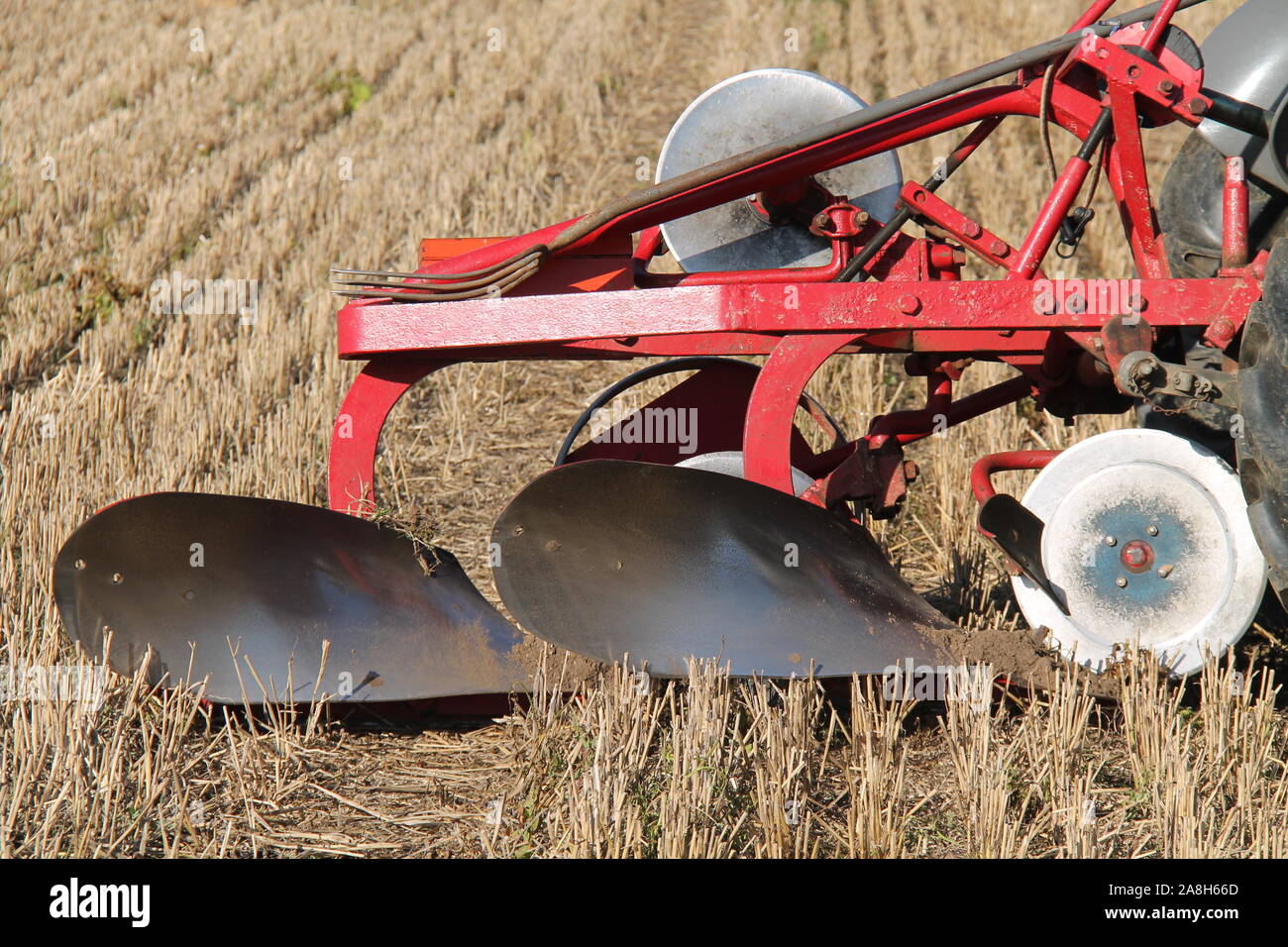 An Old Fashioned Tractor Drawn Vintage Farm Plough Stock Photo - Alamy