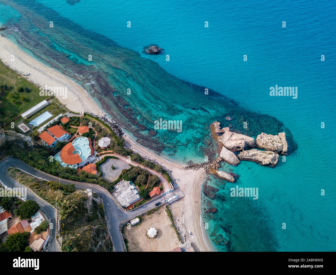 Aerial view of the Calabrian coast, villas and resorts on the cliff ...