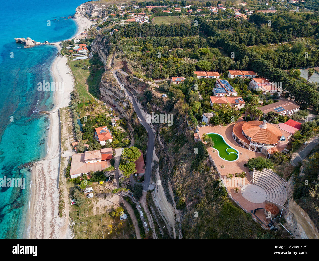 Aerial view of the Calabrian coast, villas and resorts on the cliff ...