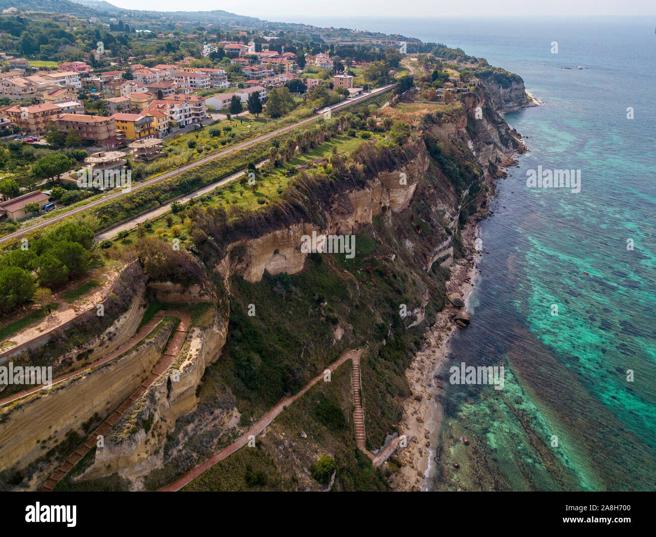 Aerial view of the Calabrian coast, villas and resorts on the cliff ...