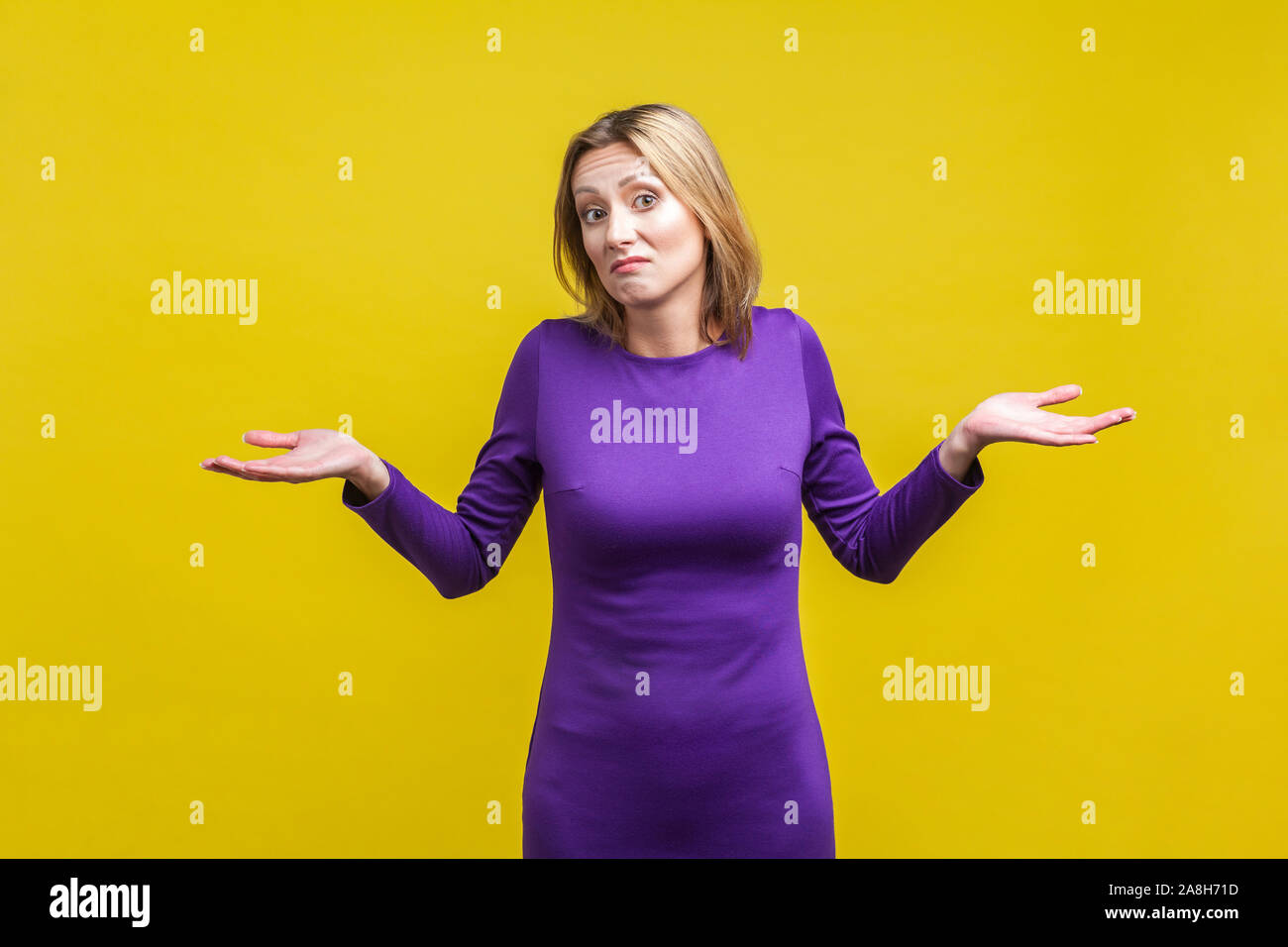 I don't know, whatever. Portrait of uncertain confused woman in tight ...