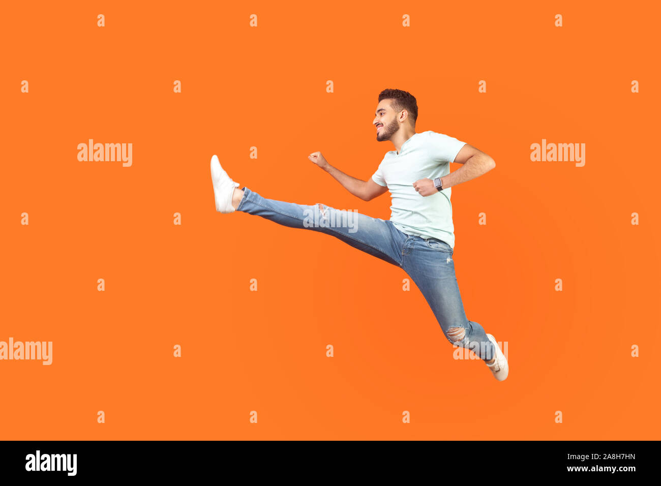 Full body portrait of excited brunette man with beard in sneakers and ...