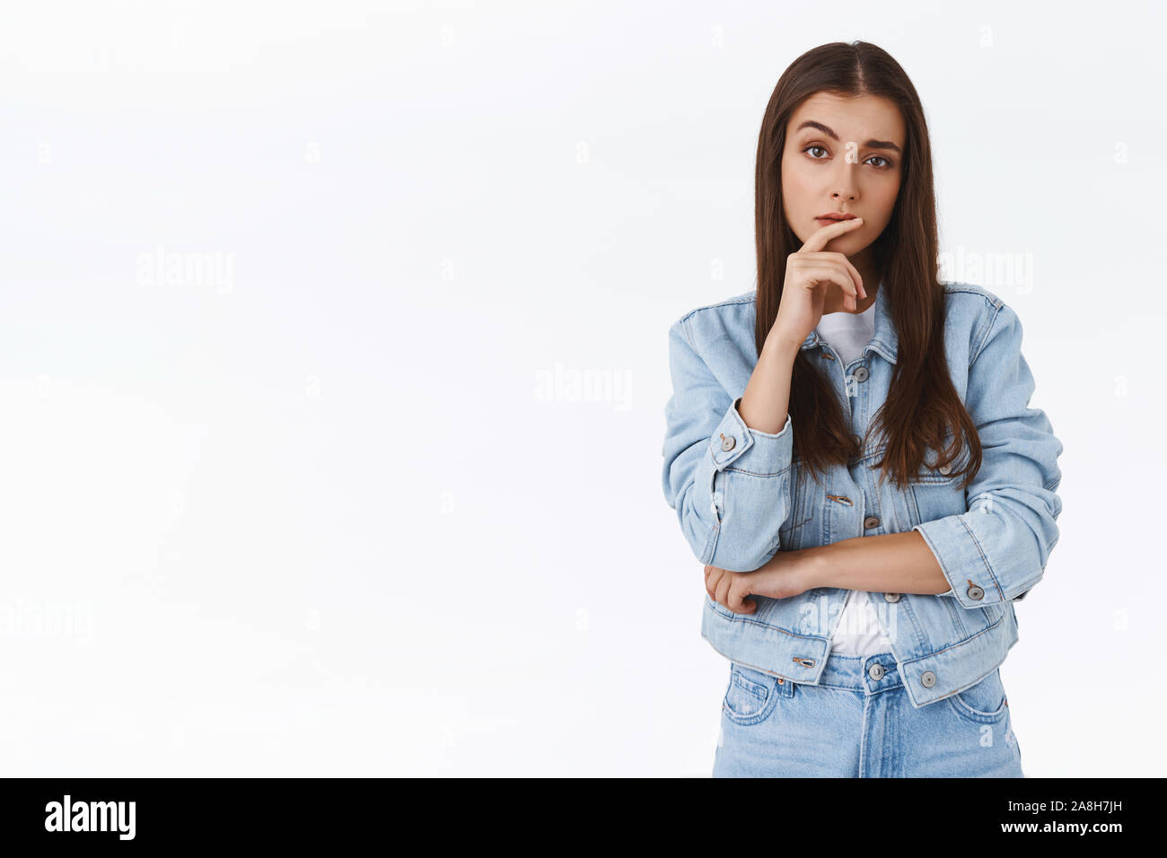 Skeptical, suspicious serious-looking thoughtful caucasian girl in ...