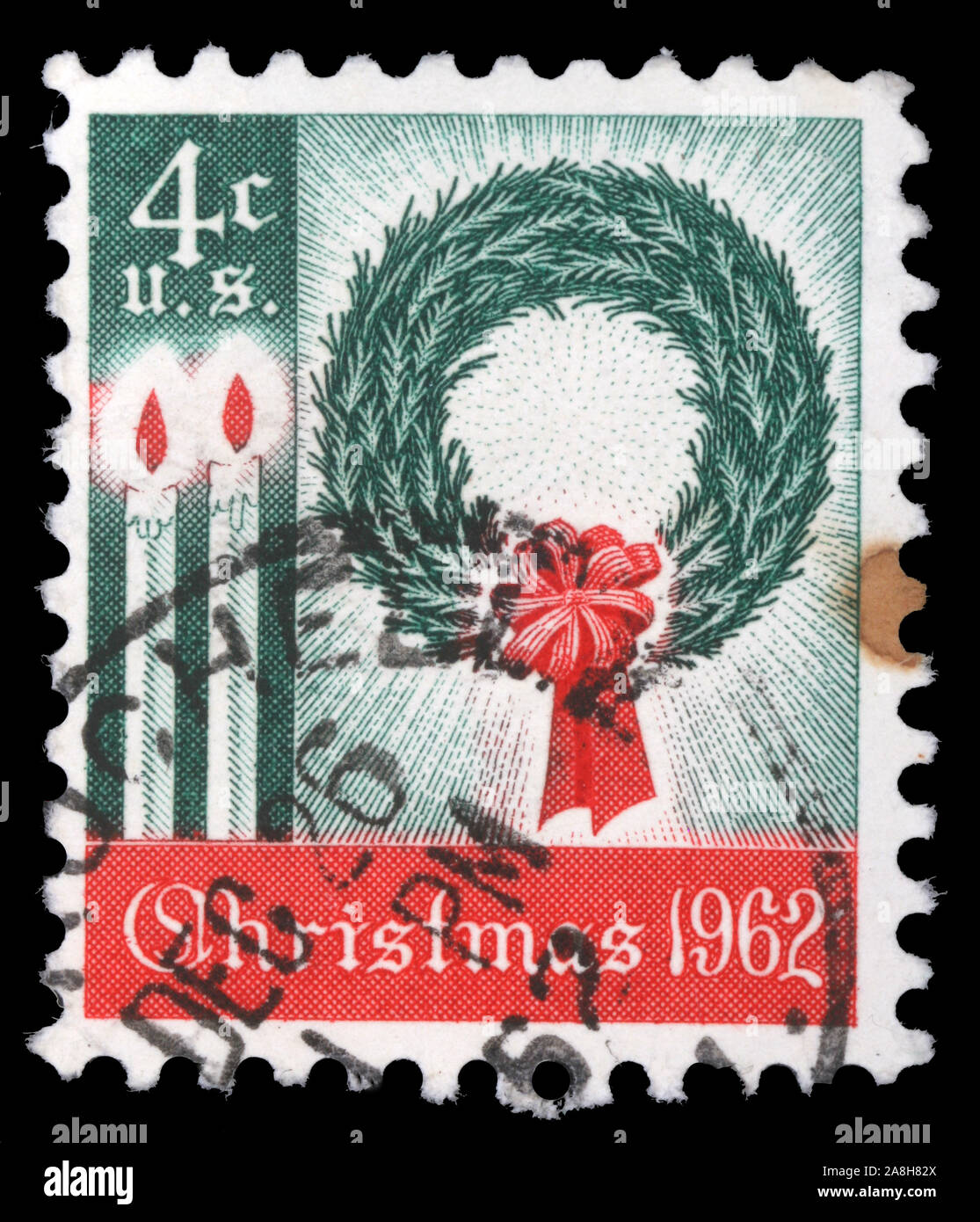 America's first Christmas postage stamp shows a wreath and candles ...