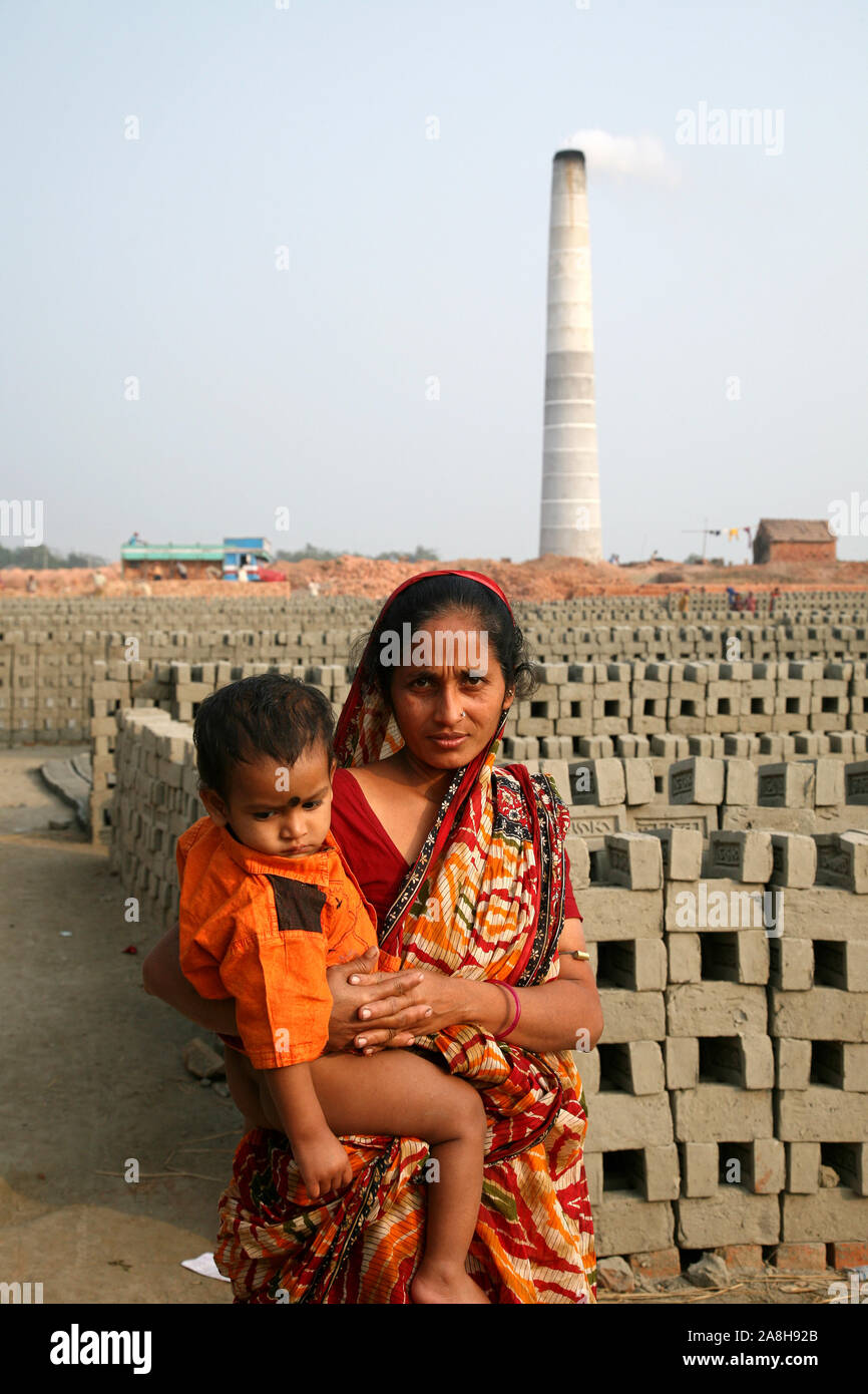 Workers live with their families within the brick factory, where they ...