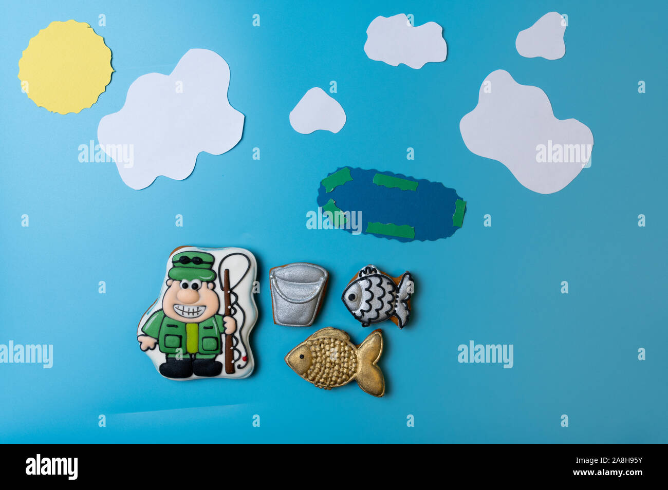 Gingerbread cookie on a fishing theme. Fisherman and a goldfish Stock ...