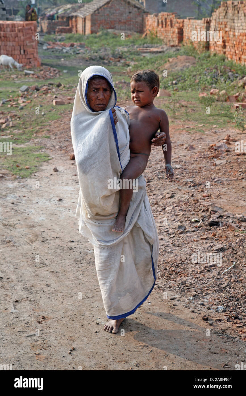 Workers live with their families within the brick factory, where they ...