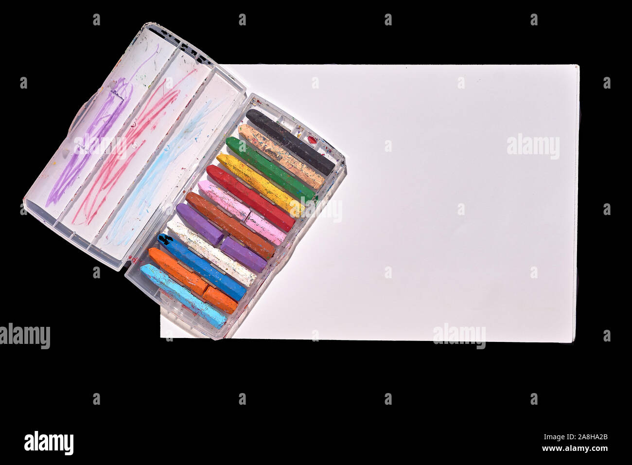 top view colorful of crayons in box after use for drawing on drawing ...