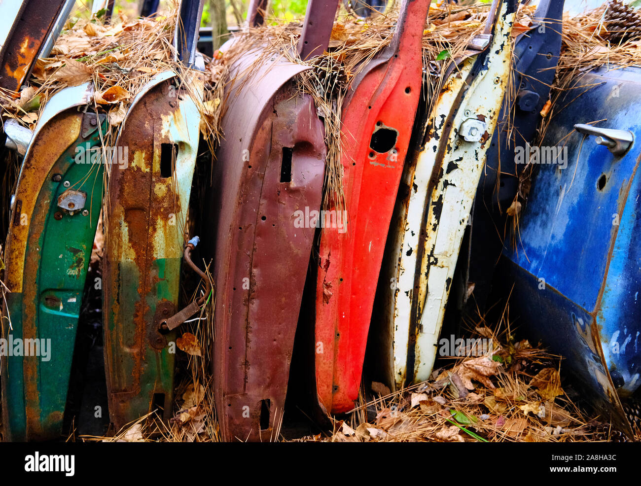 Line of Old Car Doors in a Junkyard Stock Photo - Alamy