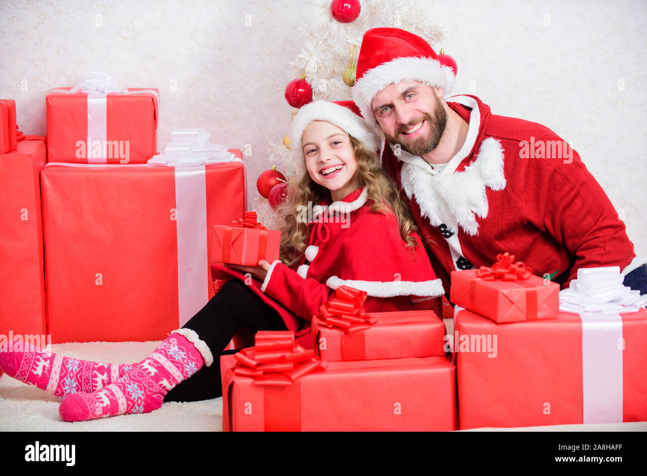 Family christmas celebration traditions. Dad in santa costume with ...