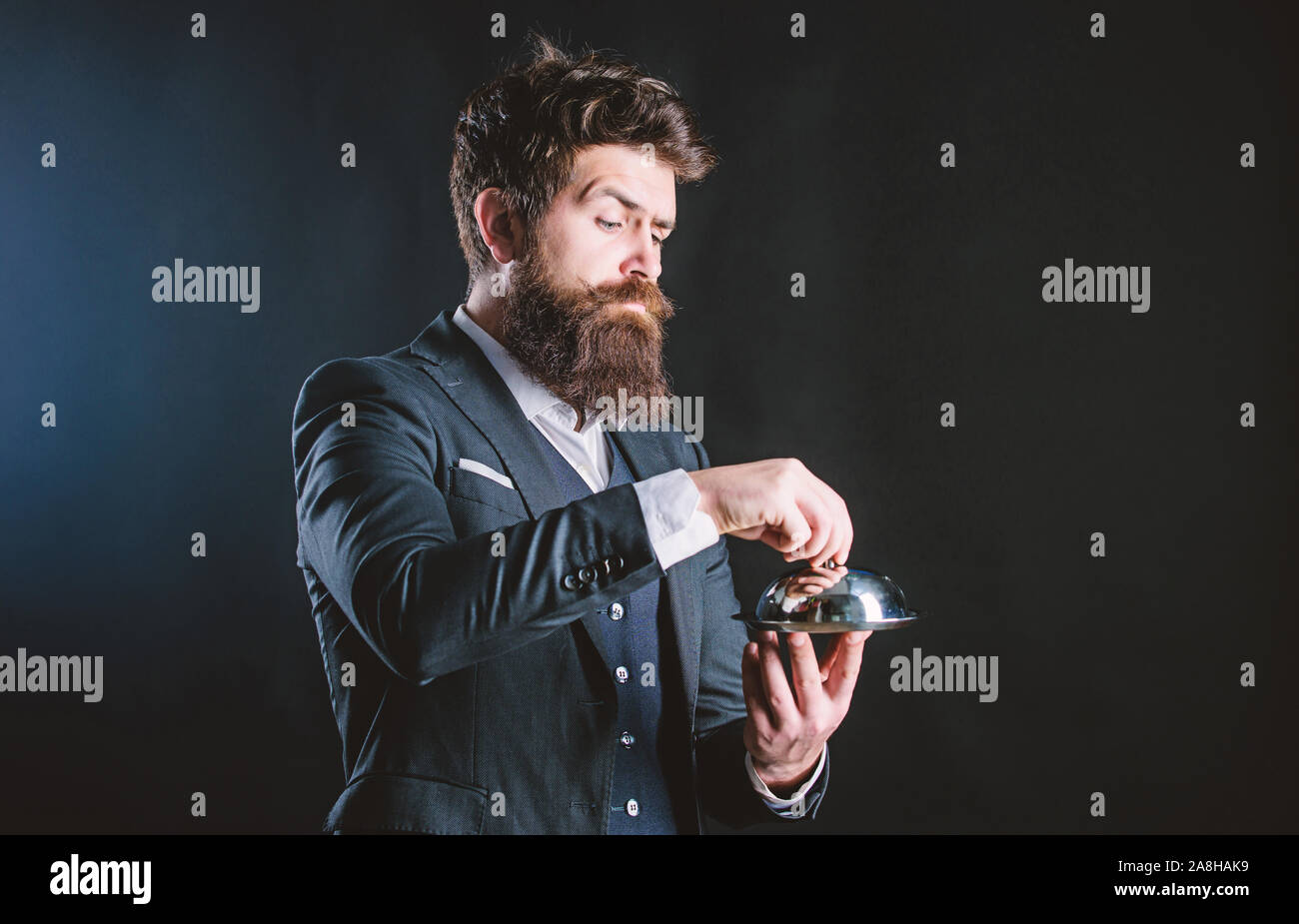 Servant carry metallic cloche. Man well groomed gentleman formal suit ...