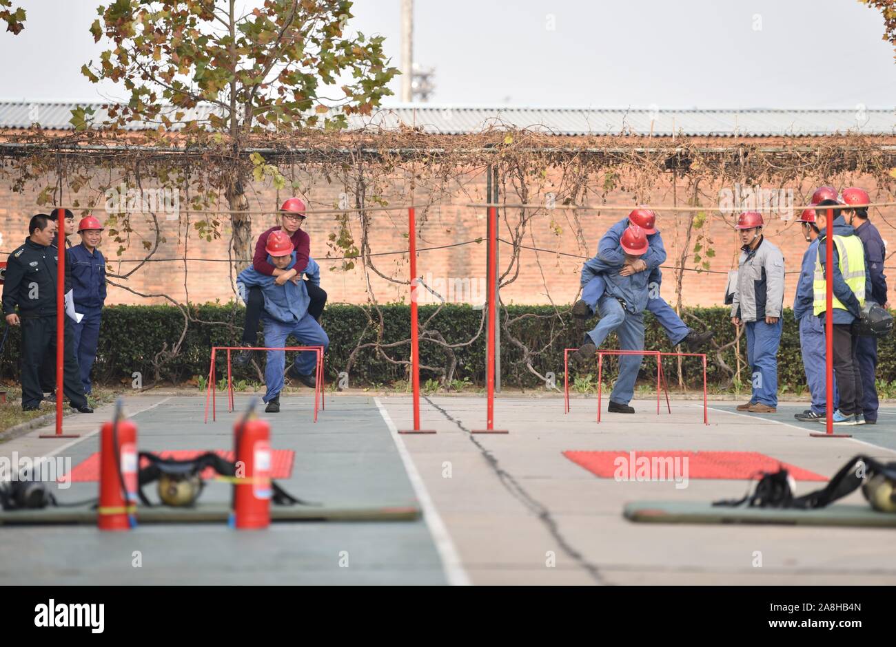 Dingzhou, China's Hebei Province. 9th Nov, 2019. Staff members ...