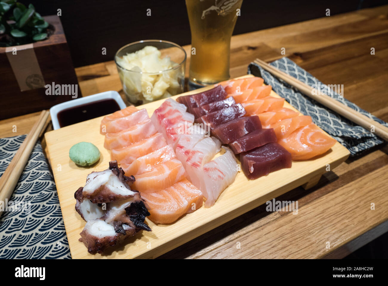 A close up view of a delicious plate of fresh sashimi in a sushi bar ...