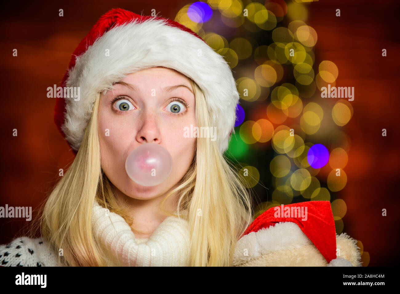 Christmas girl made bubble bubblegum. Crazy grimace. Blow Bubbles with ...