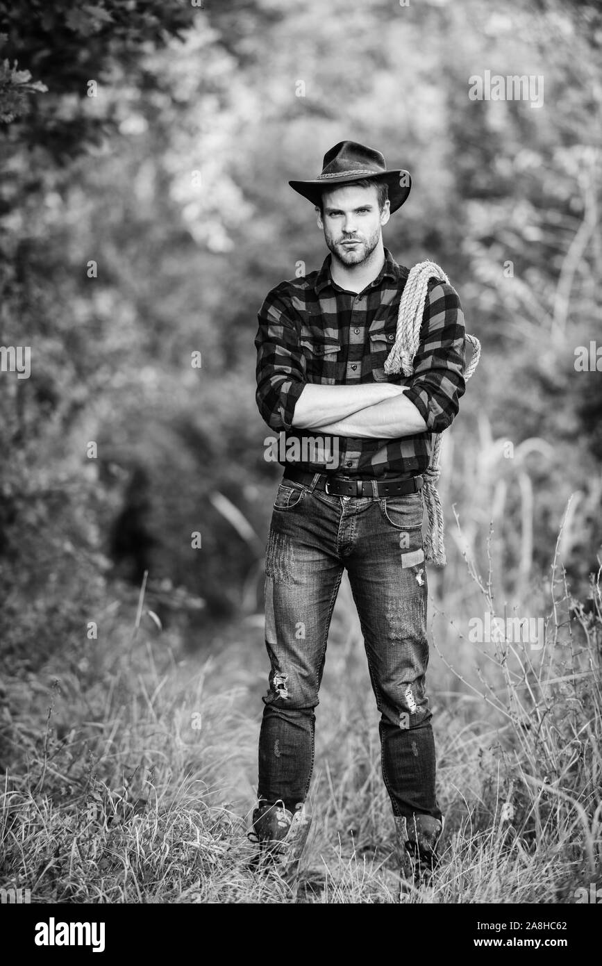 Man wearing hat hold rope. Ranch owner. attle breeding concept. Cowboy ...