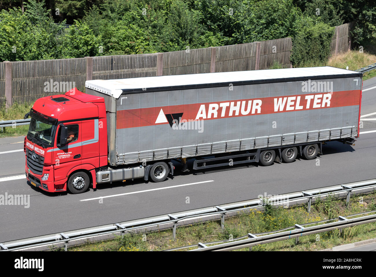 Arthur Welter Mercedes-Benz truck with curtainside trailer on motorway ...