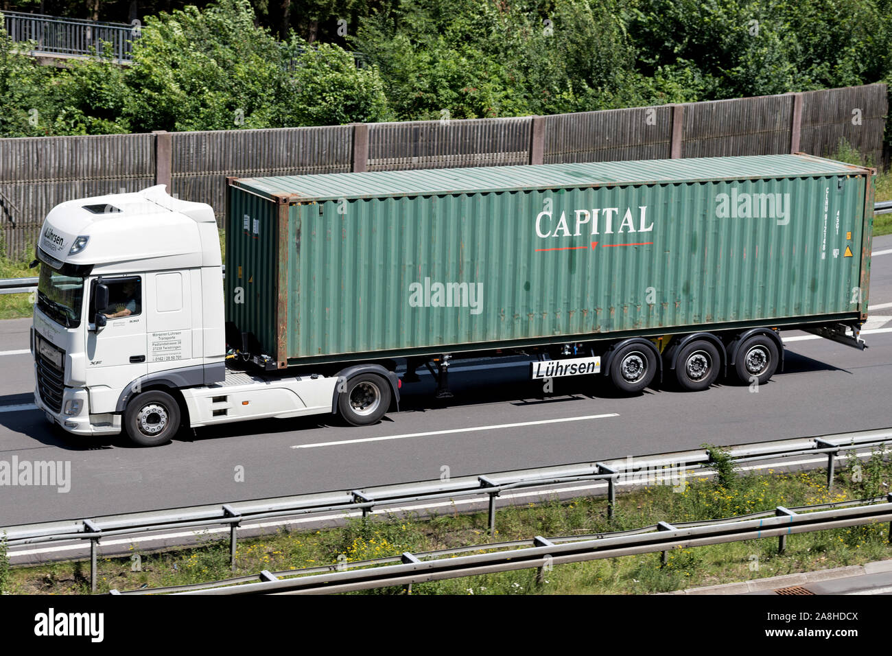 Lührsen DAF truck with Capital container on motorway Stock Photo - Alamy