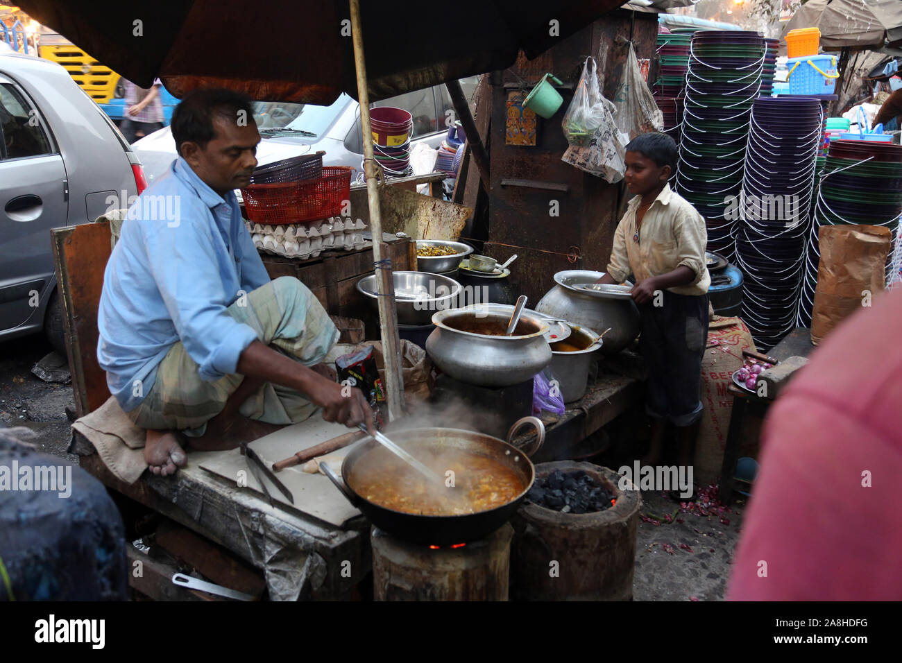Father and son prepares simple street food outdoor in Kolkata Stock ... Father and son prepares simple street food outdoor in Kolkata Stock ...