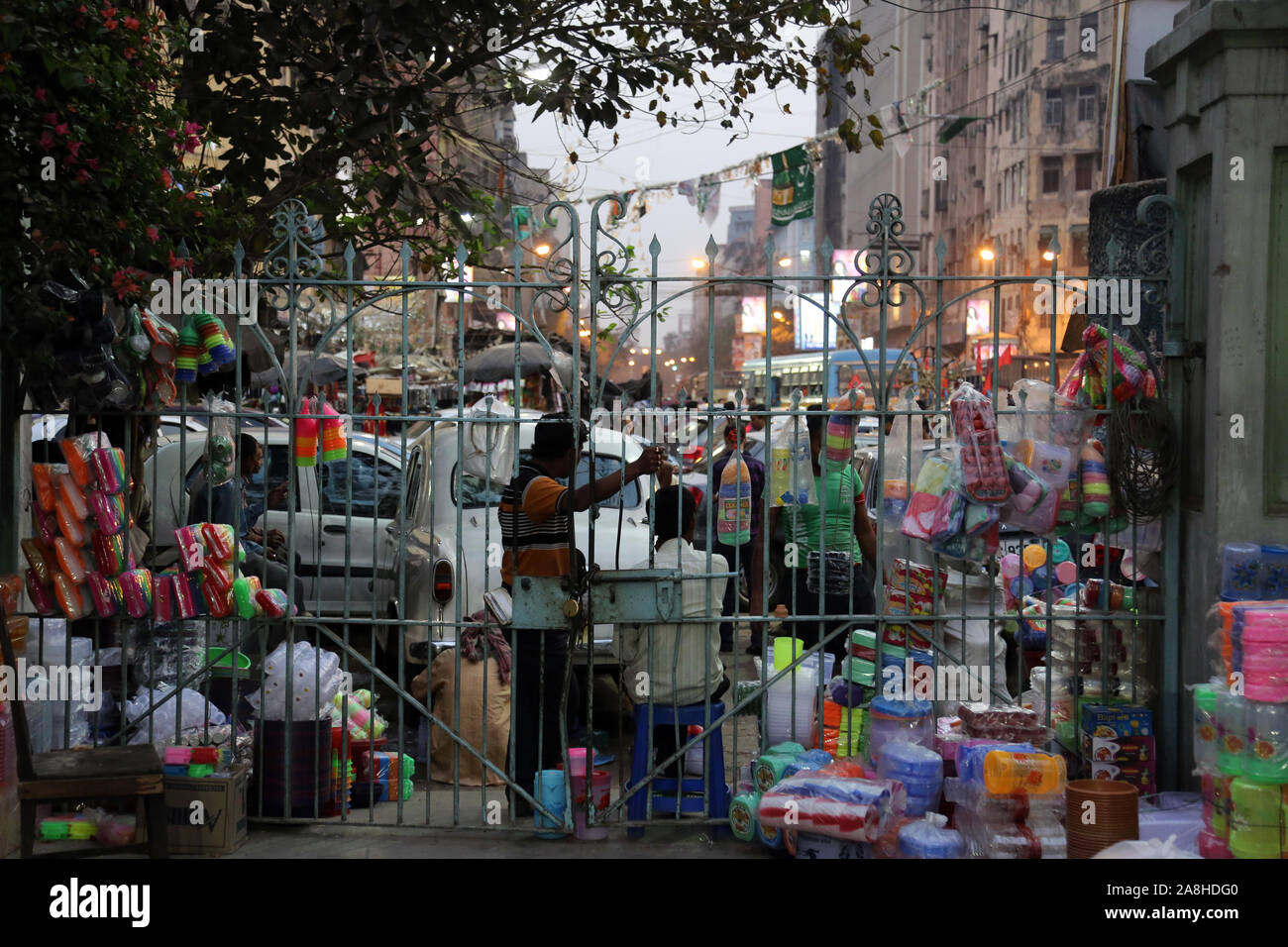 Dark city traffic blurred in motion at late evening on crowded streets ...