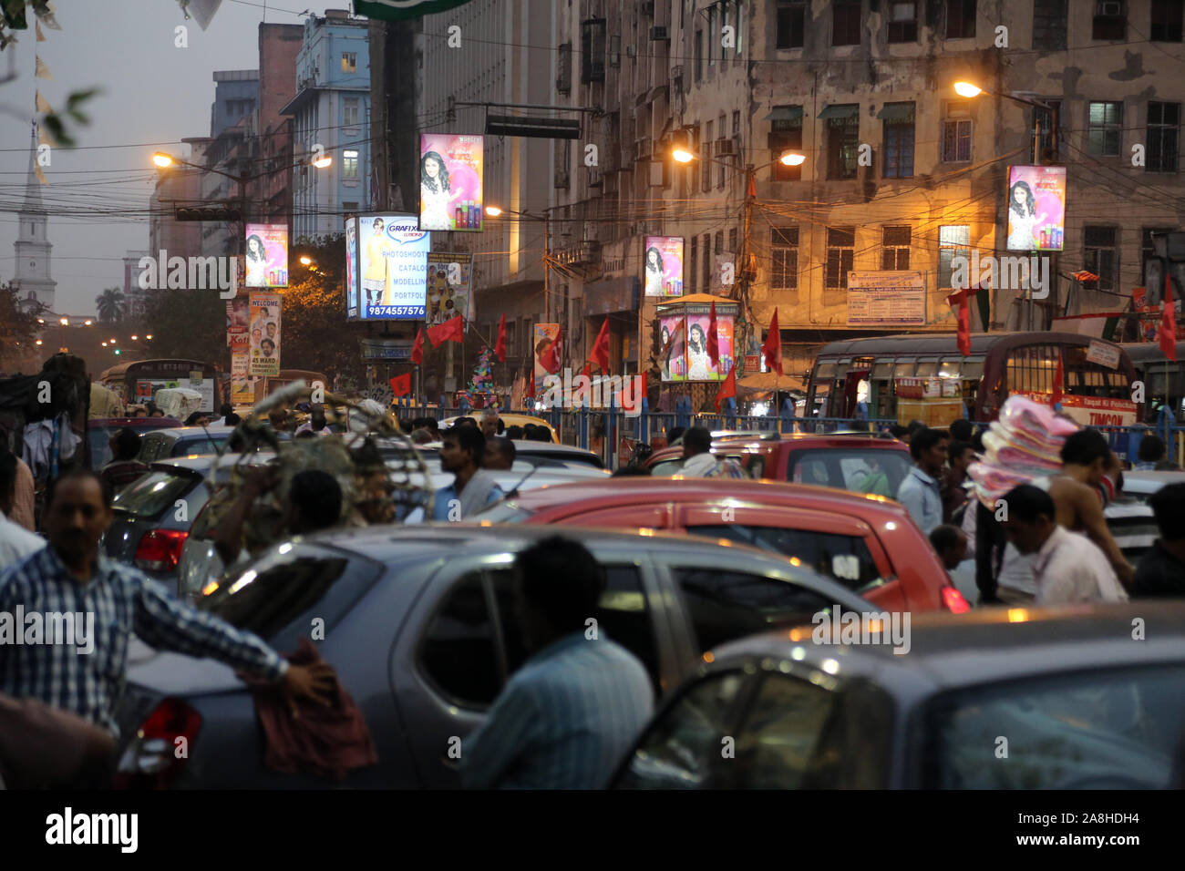 Dark city traffic blurred in motion at late evening on crowded streets ...