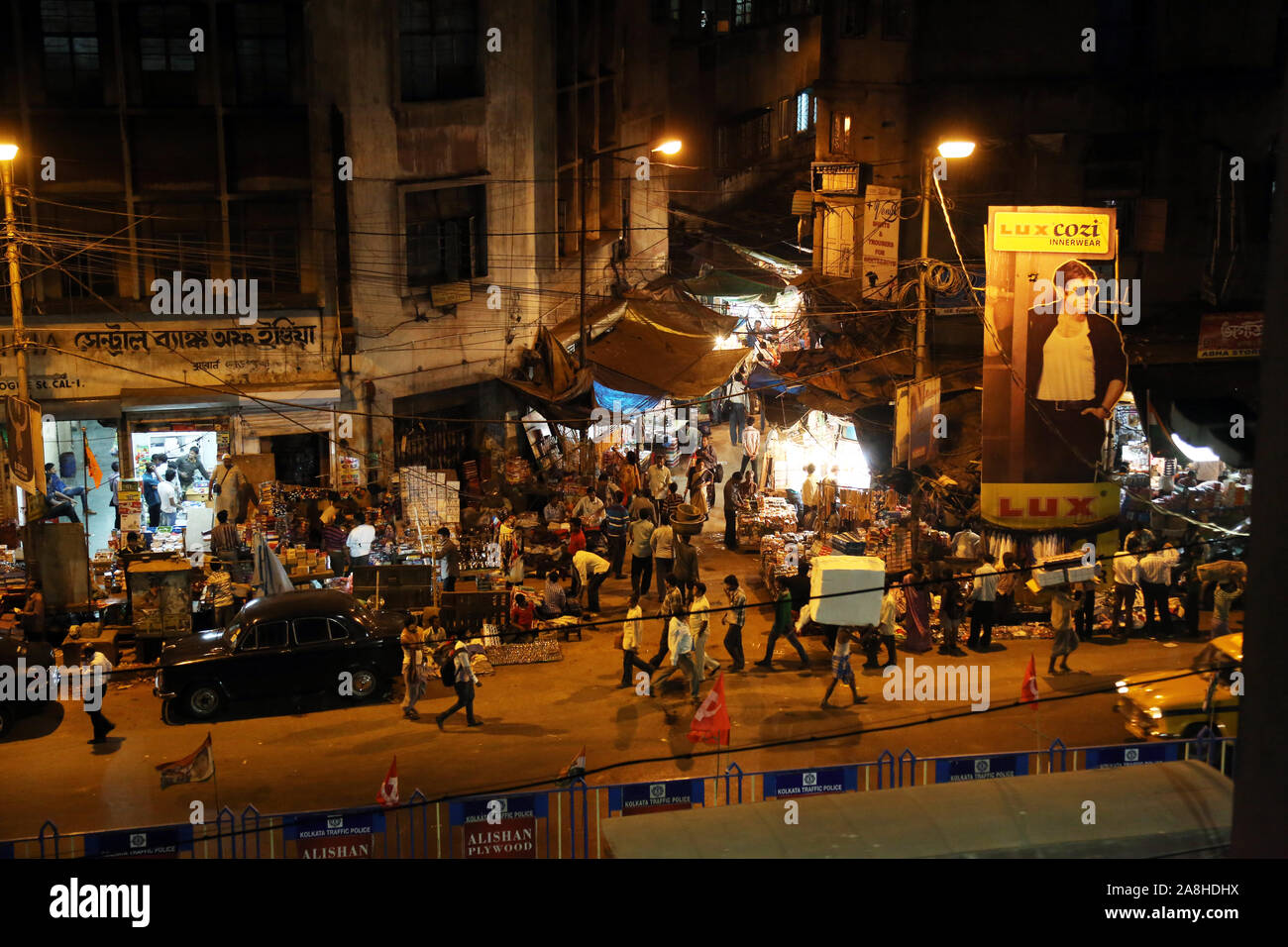 Dark city traffic blurred in motion at late evening on crowded streets ...
