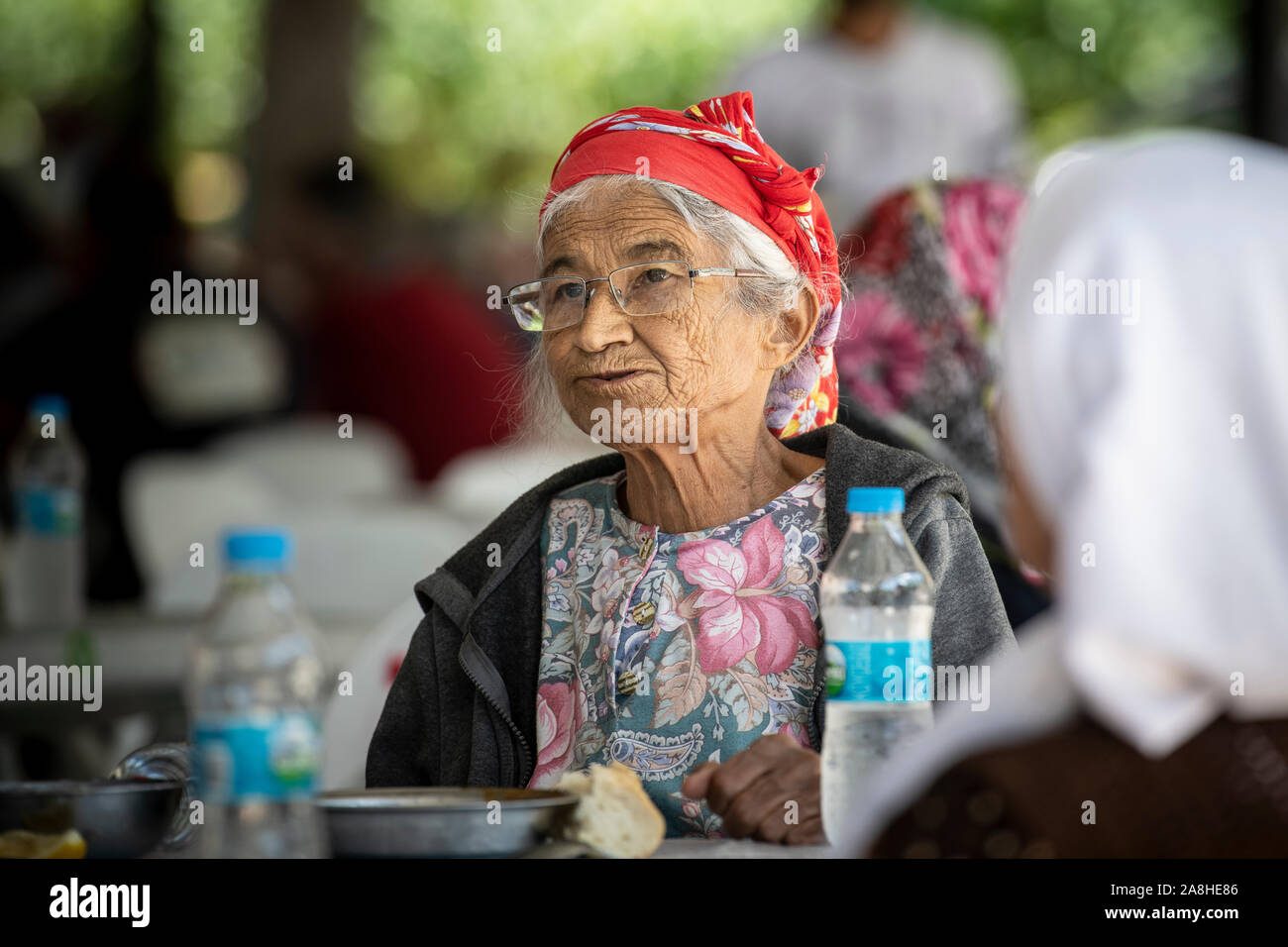 A beautiful, elderly lady living a semi nomadic lifestyle in a village ...