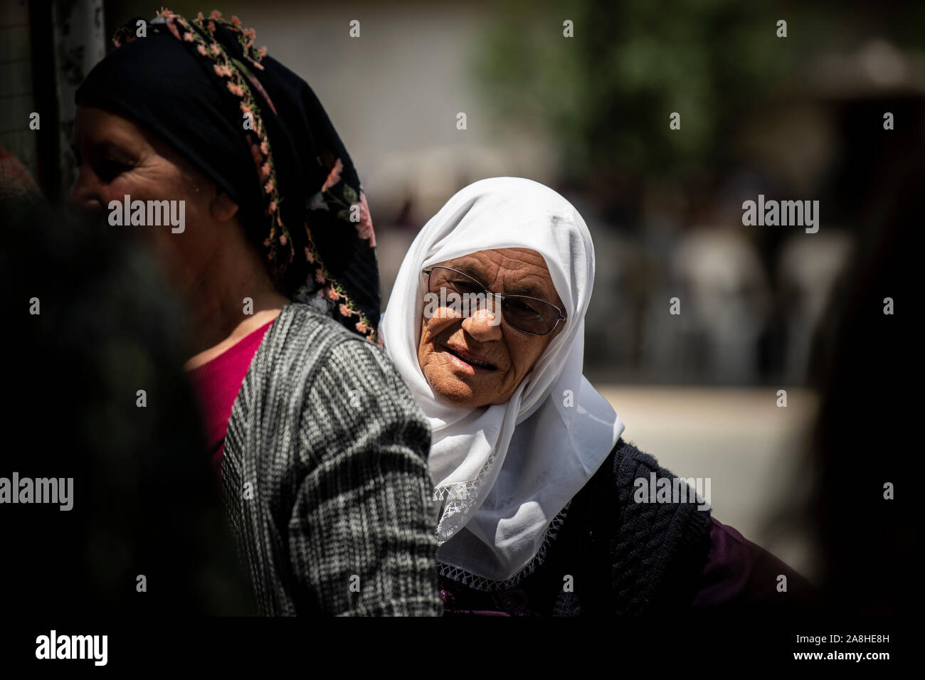A beautiful, elderly lady living a semi nomadic lifestyle in a village ...