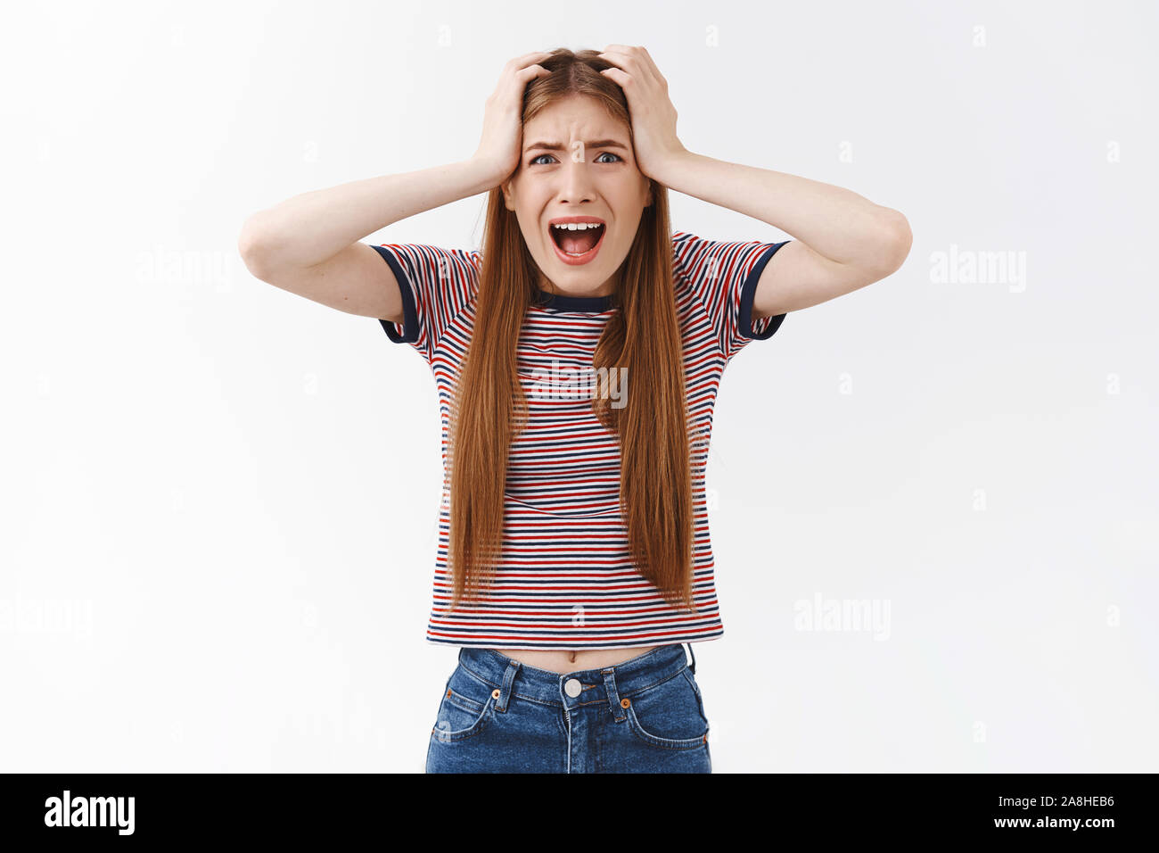 Concerned, scared young female student see dog wripped her homework ...