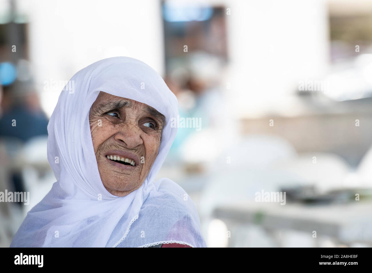 A beautiful, elderly lady living a semi nomadic lifestyle in a village ...