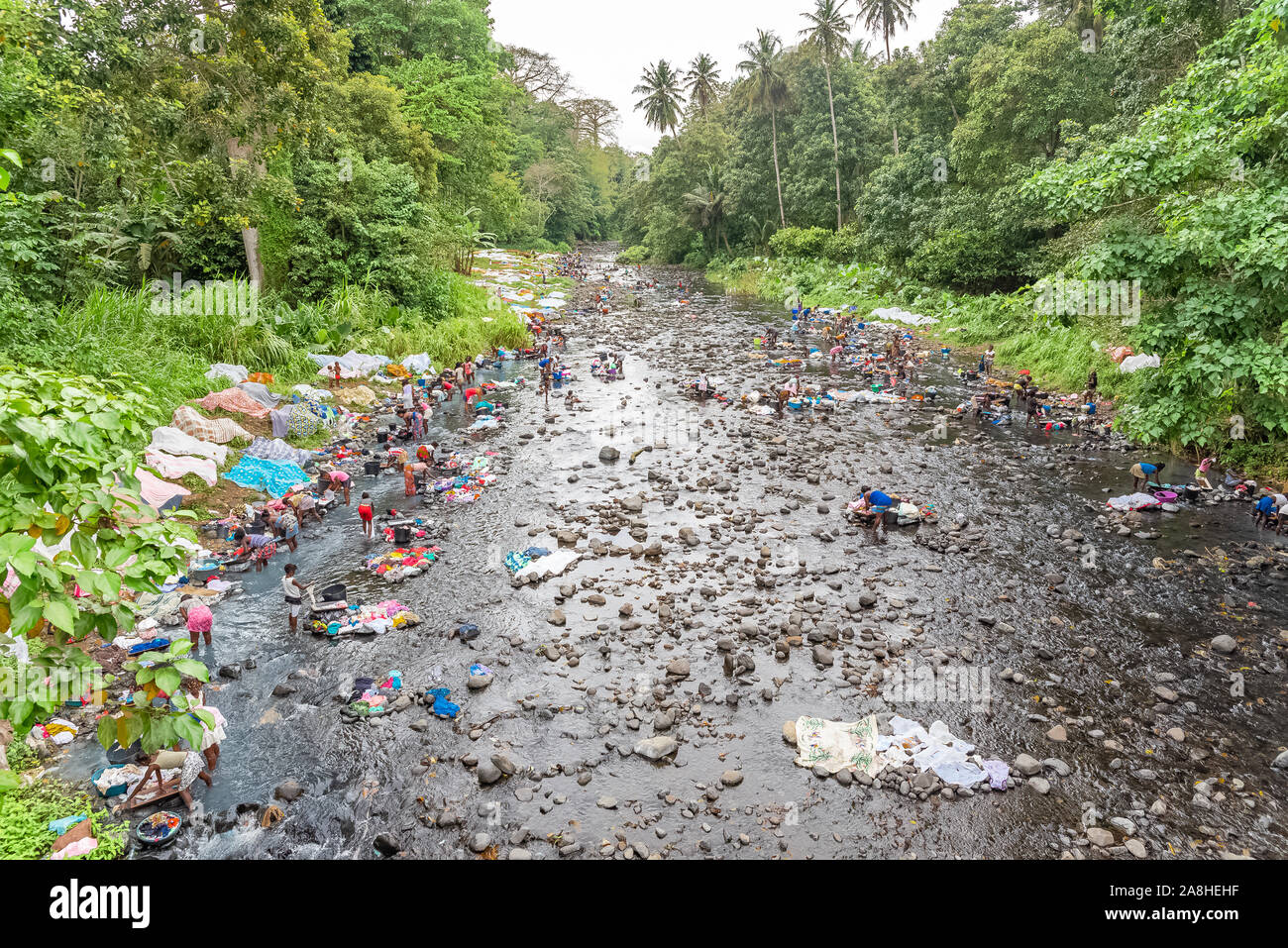 Washing clothes in dirty river hi-res stock photography and images - Alamy