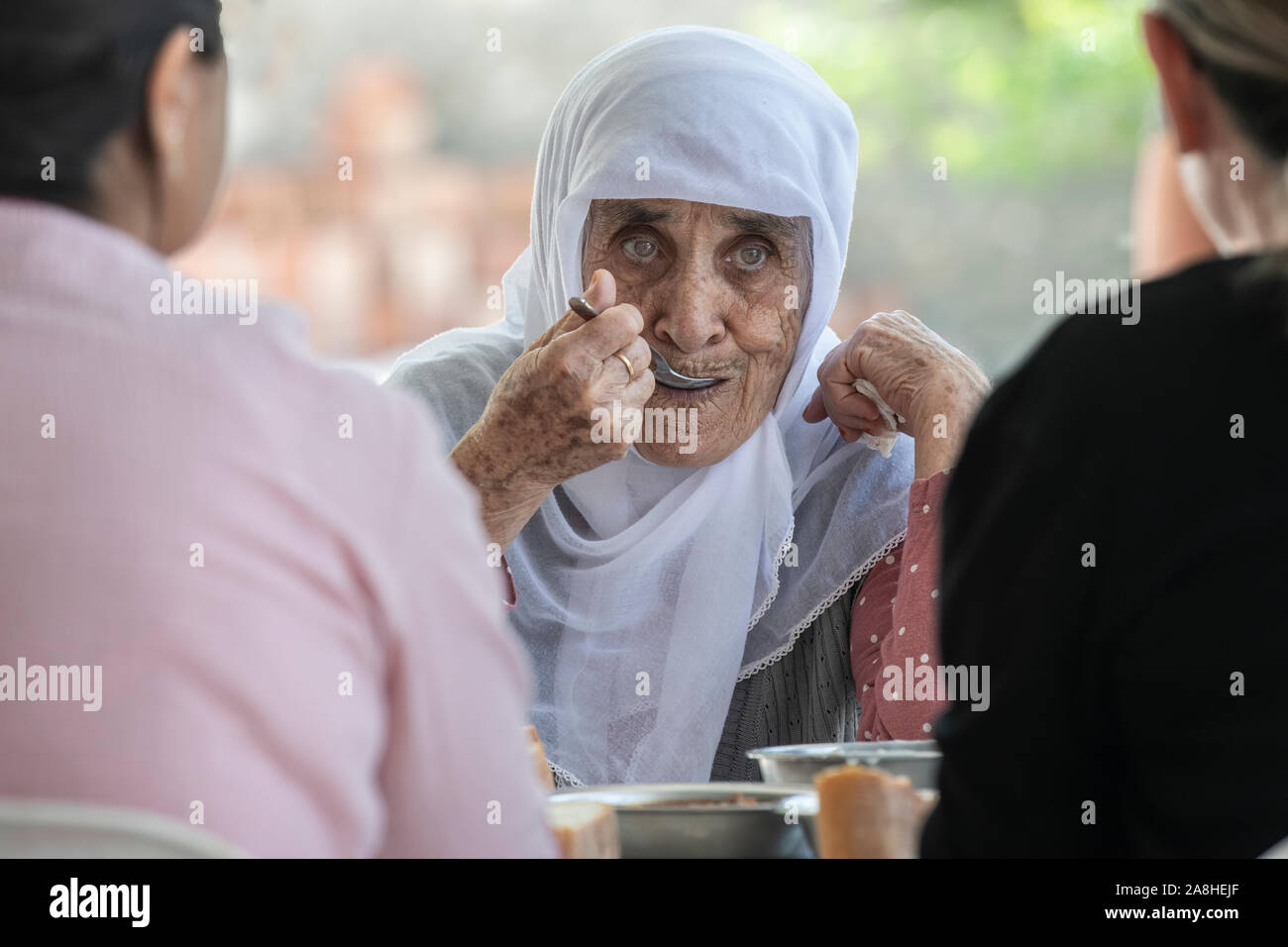 A beautiful, elderly lady living a semi nomadic lifestyle in a village ...