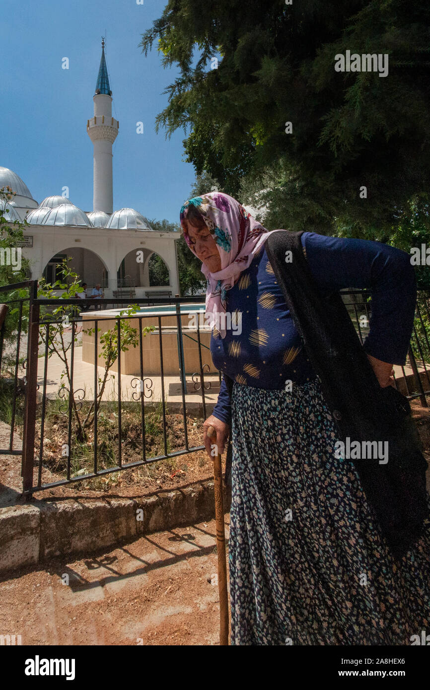 A beautiful, elderly lady living a semi nomadic lifestyle in a village ...