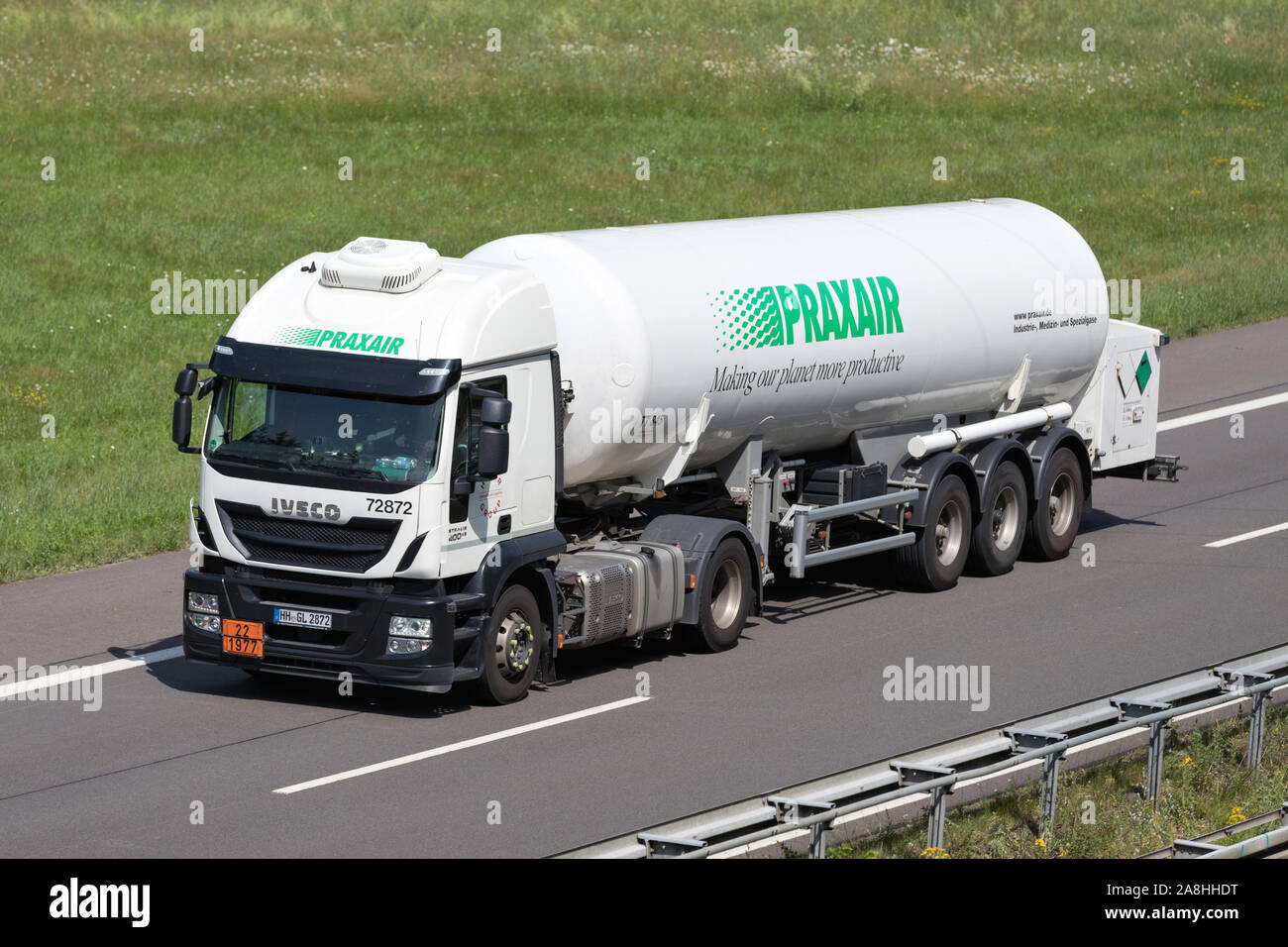Hoyer Iveco Stralis truck with Praxair trailer on motorway Stock Photo ...