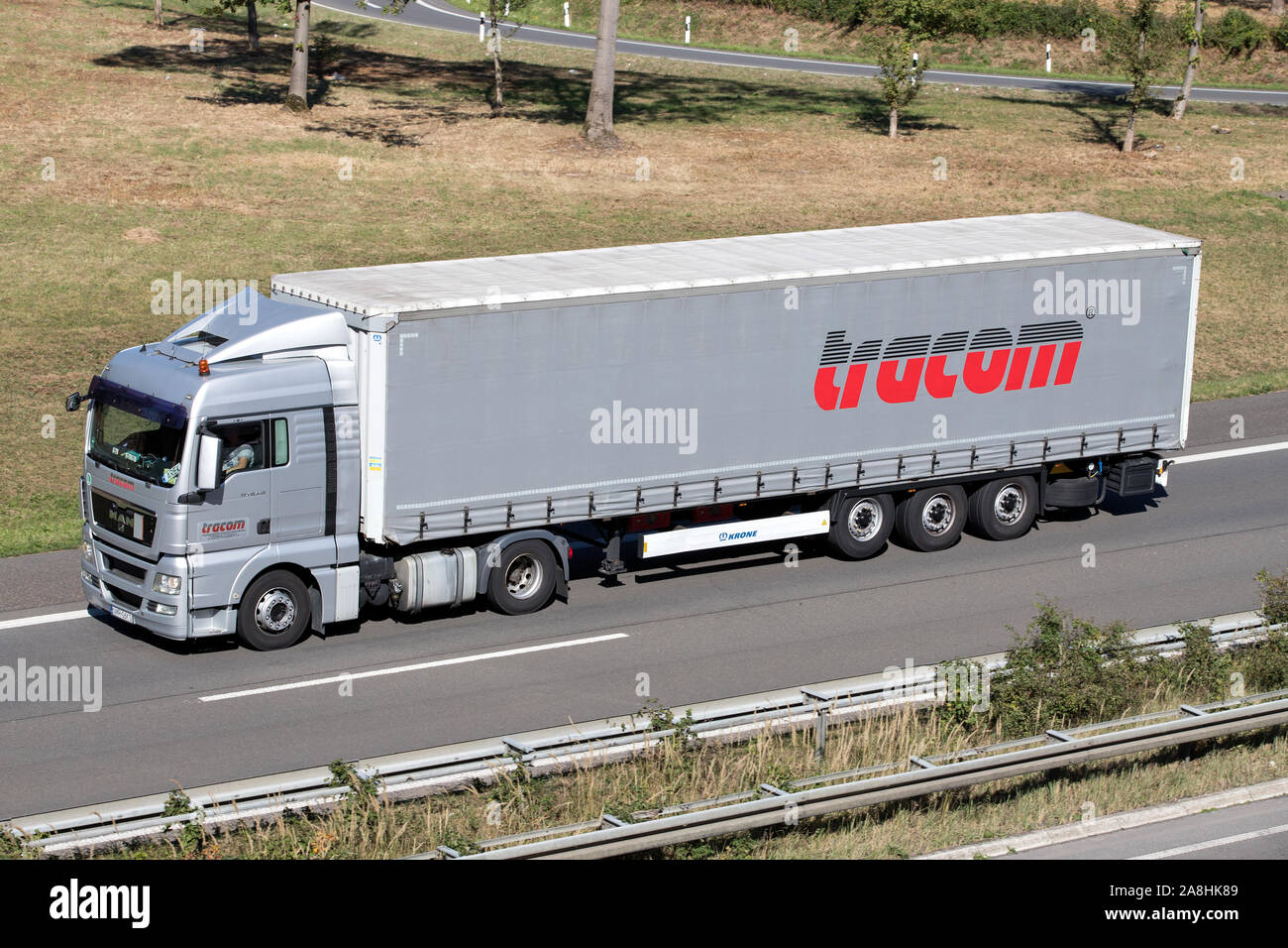 Tracom MAN TGX truck with curtainside trailer on motorway Stock Photo ...