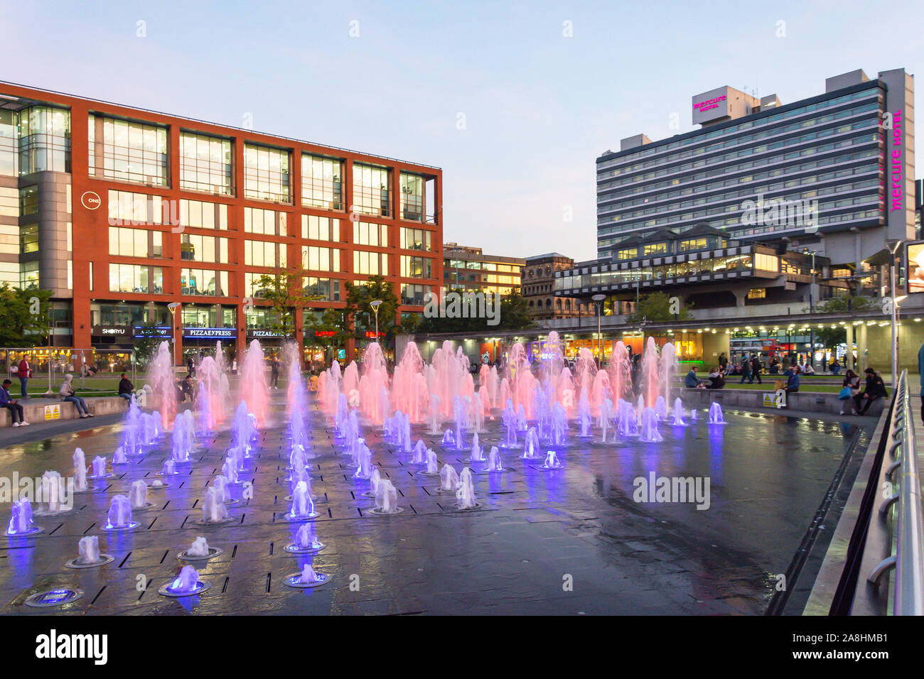 The fountain in Piccadilly Gardens at dusk, City Centre, Manchester ...