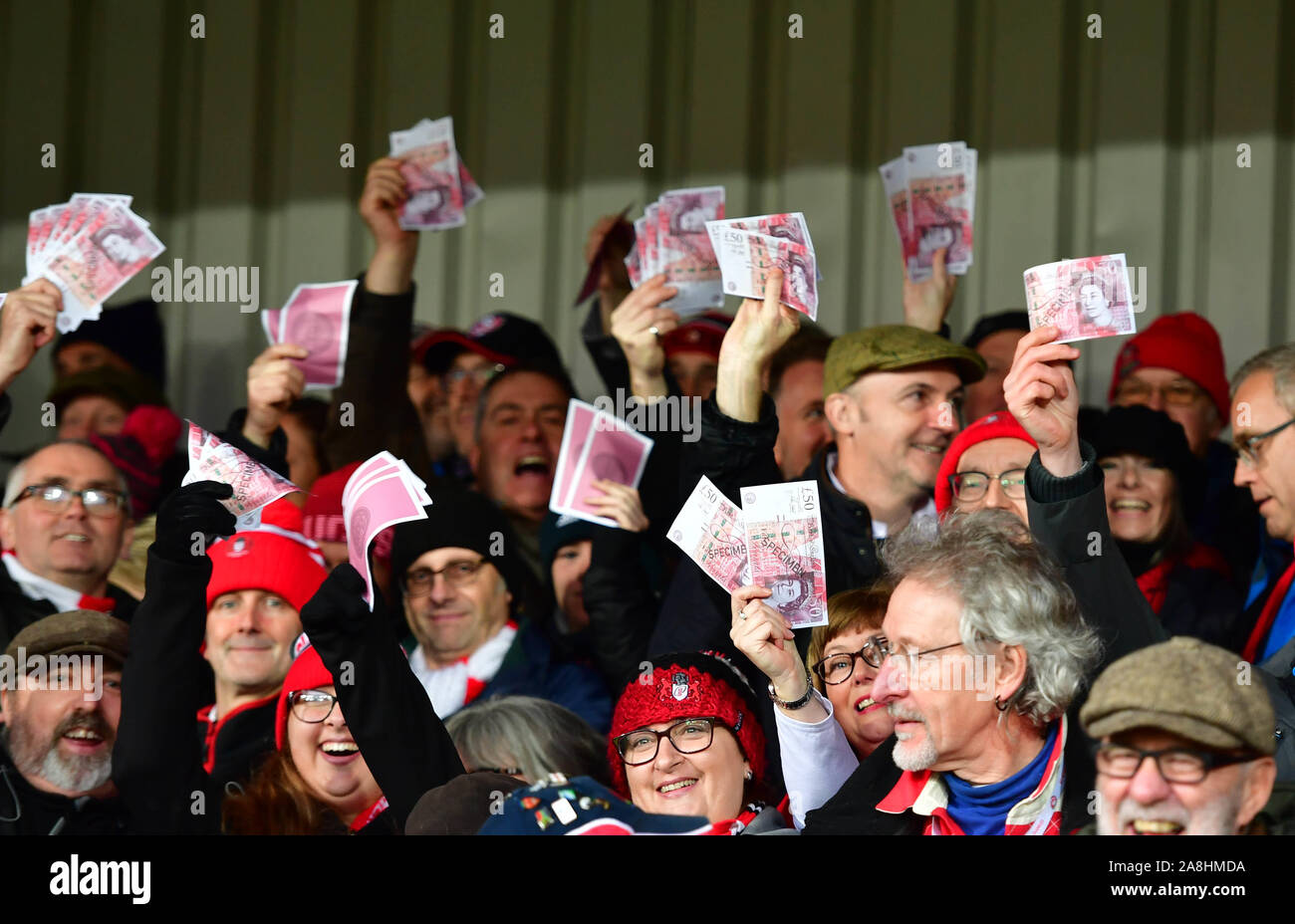 Gloucester fans waving fake money and wearing caps during the Gallagher ...